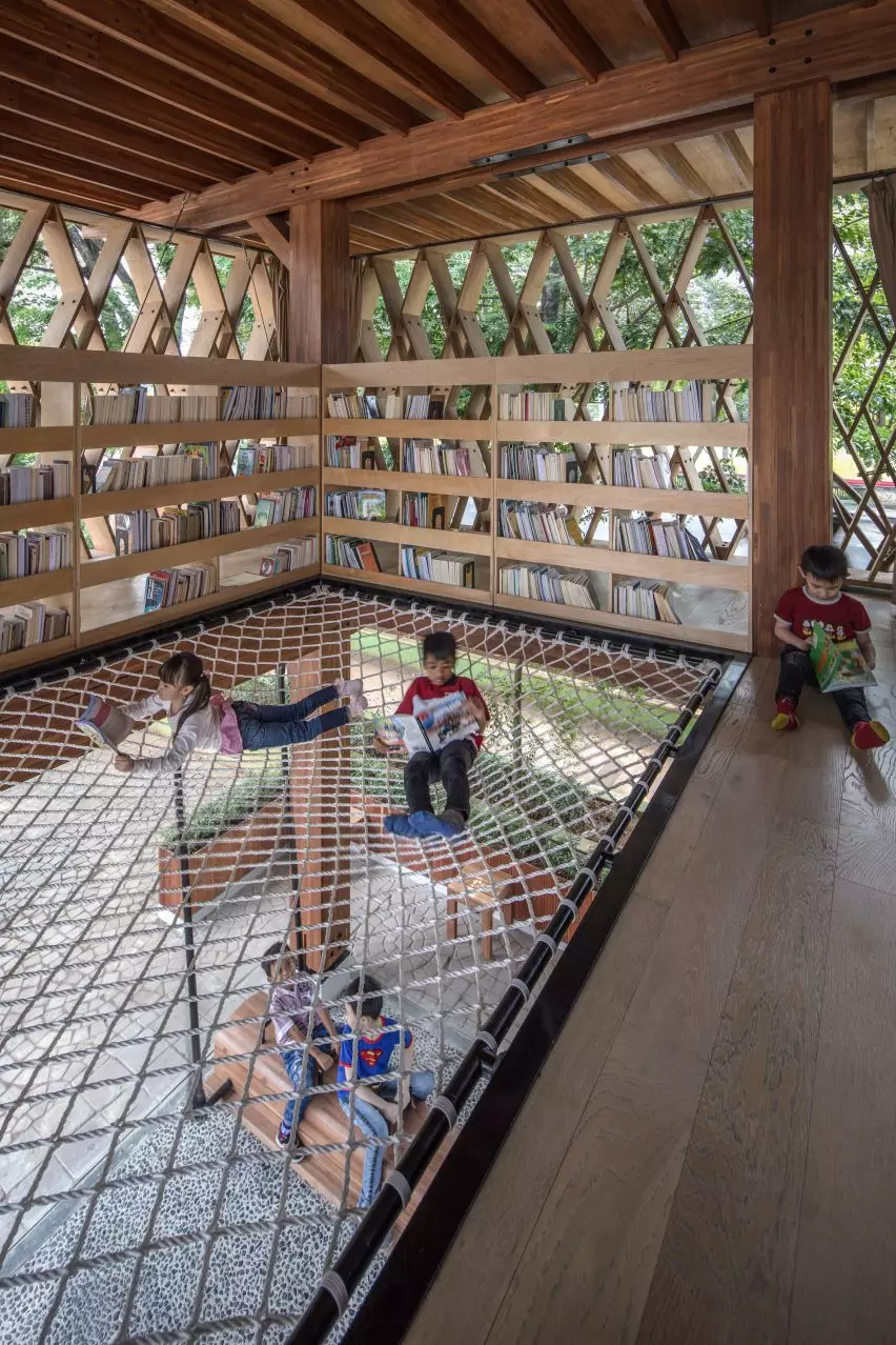 Microlibrary Warak Kayu by Shau hammock-style net floor