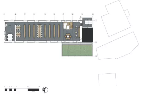 Fienile in pietra ristrutturato per creare una biblioteca universitaria da John McAslan + Partners